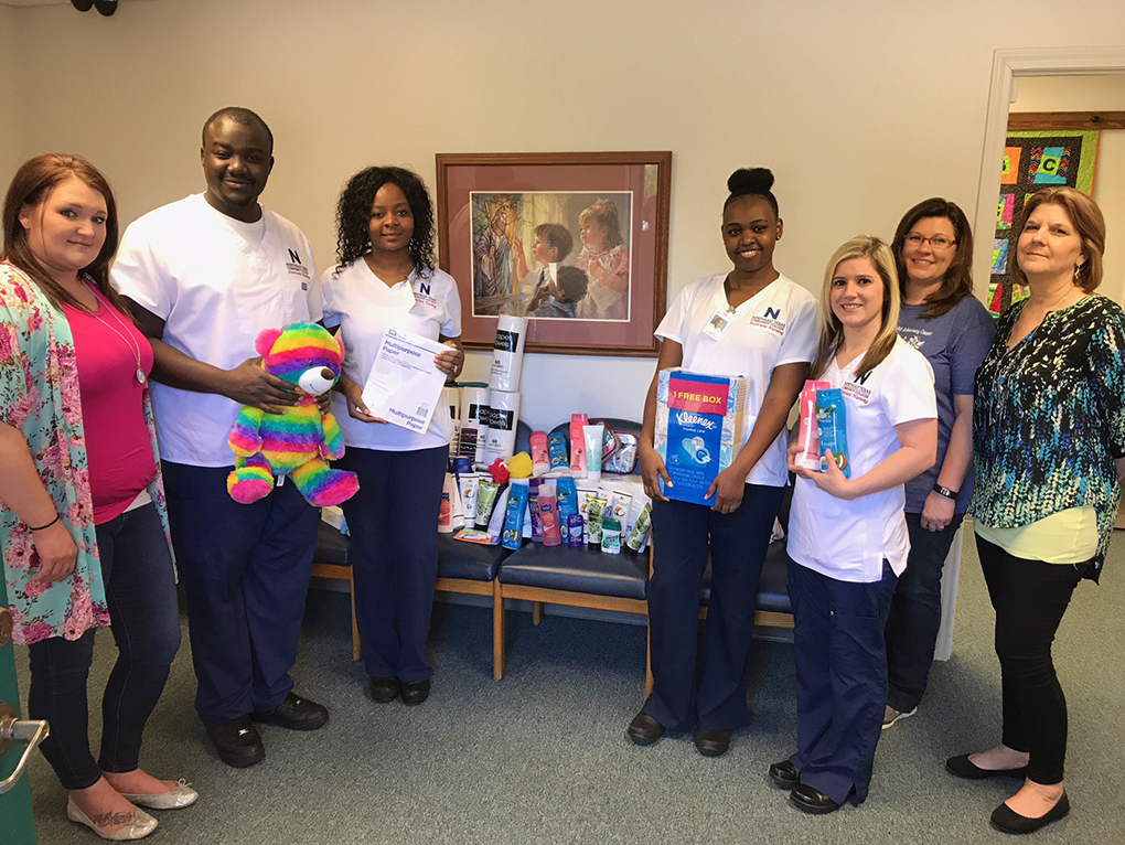 Alpha Delta Nu makes donation to Northeast Child Advocacy Center ...